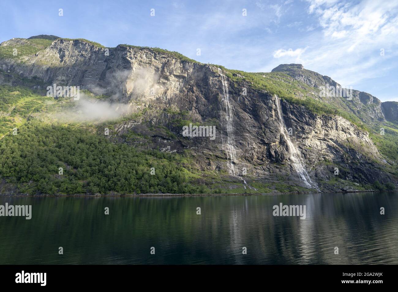 Waterfalls over the cliffs along the 15 Km Geirangerfjord in Sunnmore ...