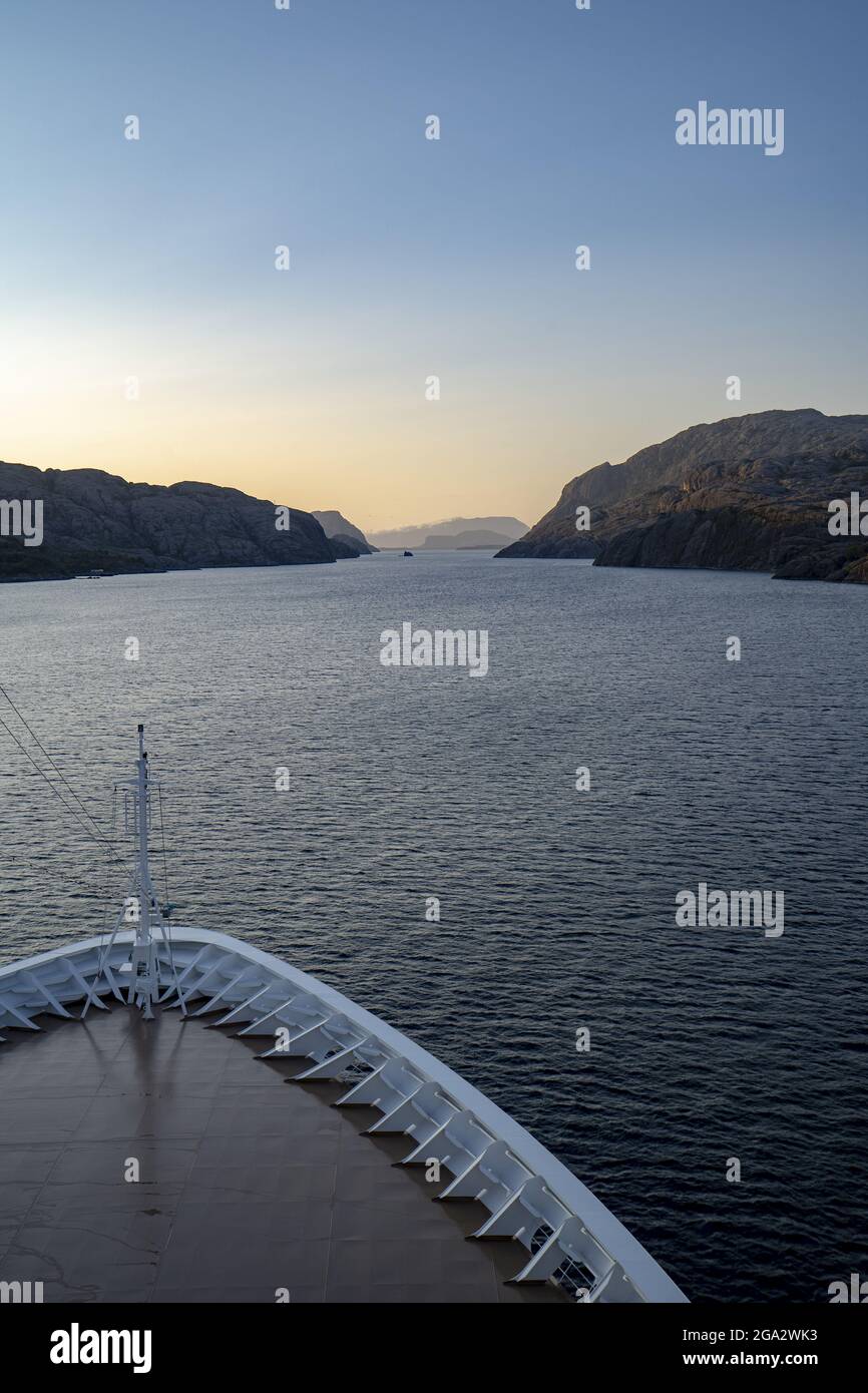 Midnight sun seen from a cruise ship in the fjords; Western Fjords ...