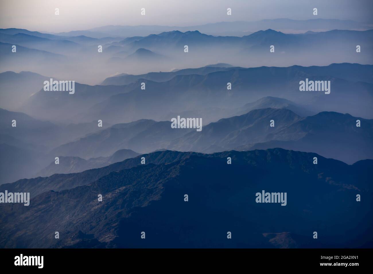 View of Himalayan foothills from window on dawn Kathmandu to Everest ...