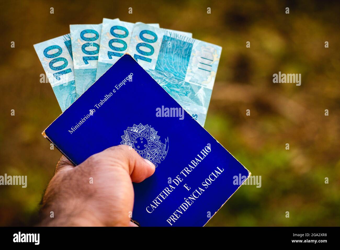 In this photo illustration, a man displays his Work and Social Security ...