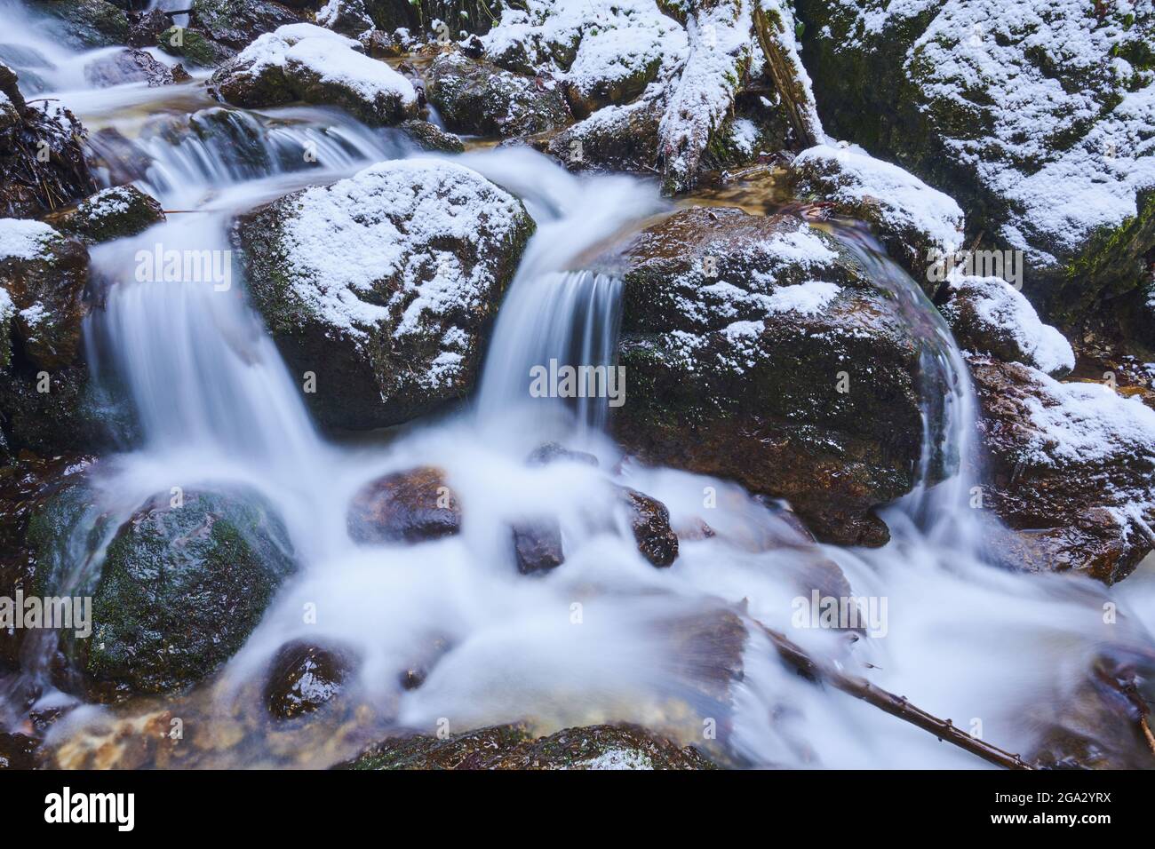 Detail of a snowy waterfall flowing over the rocks at Janosikove Diery ...