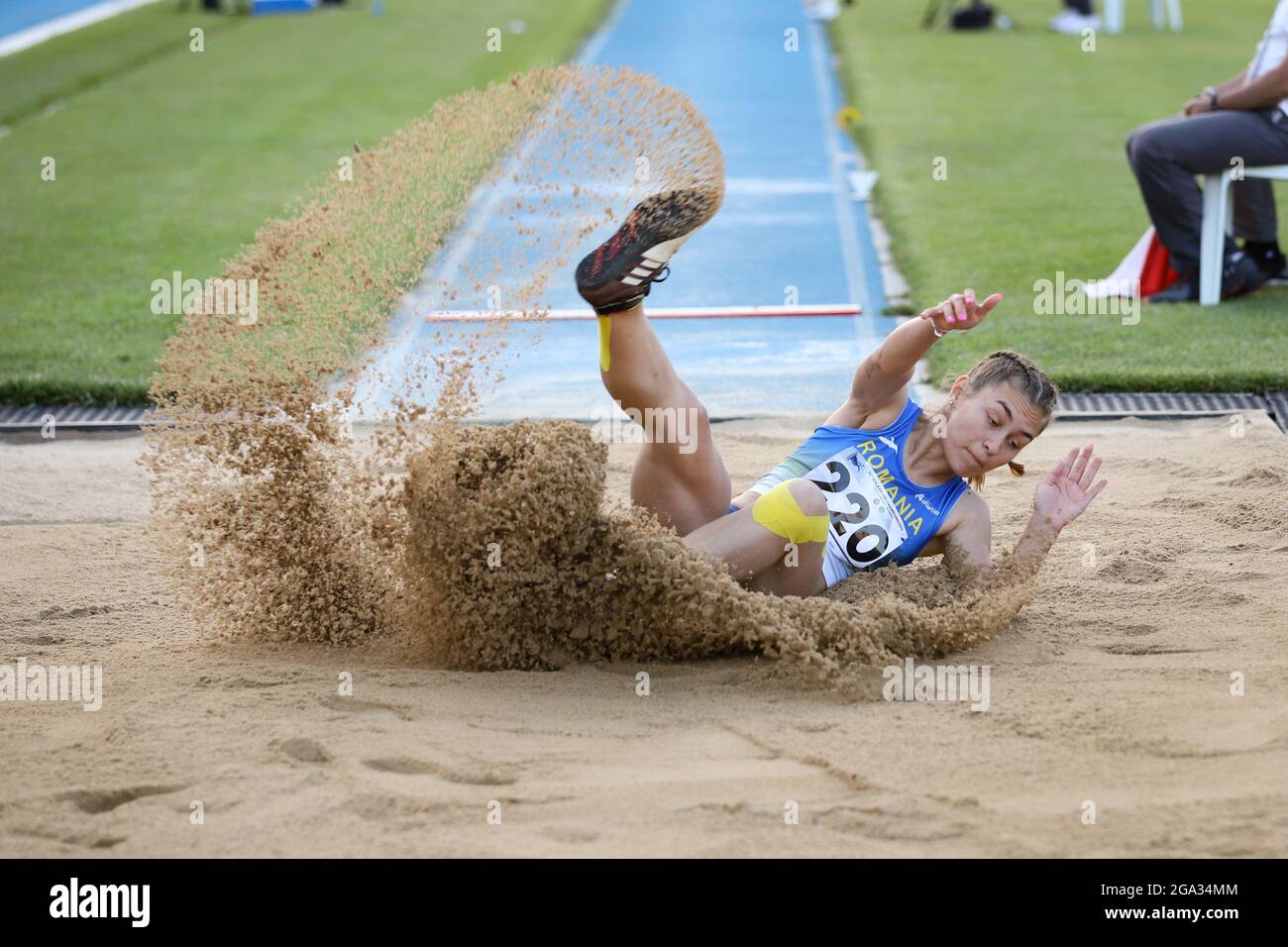 ISTANBUL, TURKEY - JUNE 13, 2021: Undefined athlete long jumping during ...