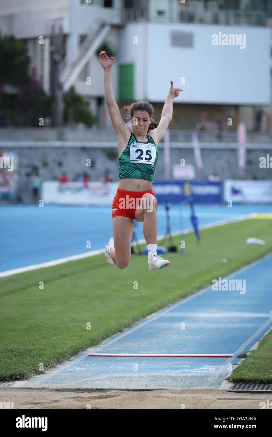 ISTANBUL, TURKEY - JUNE 13, 2021: Undefined athlete long jumping during ...