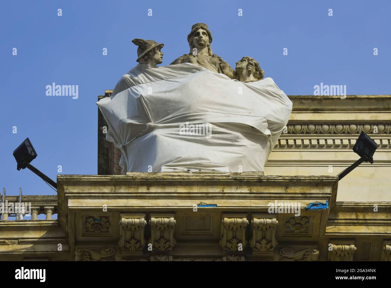 Statues on a building wrapped for restoration; Rome, Italy Stock Photo ...