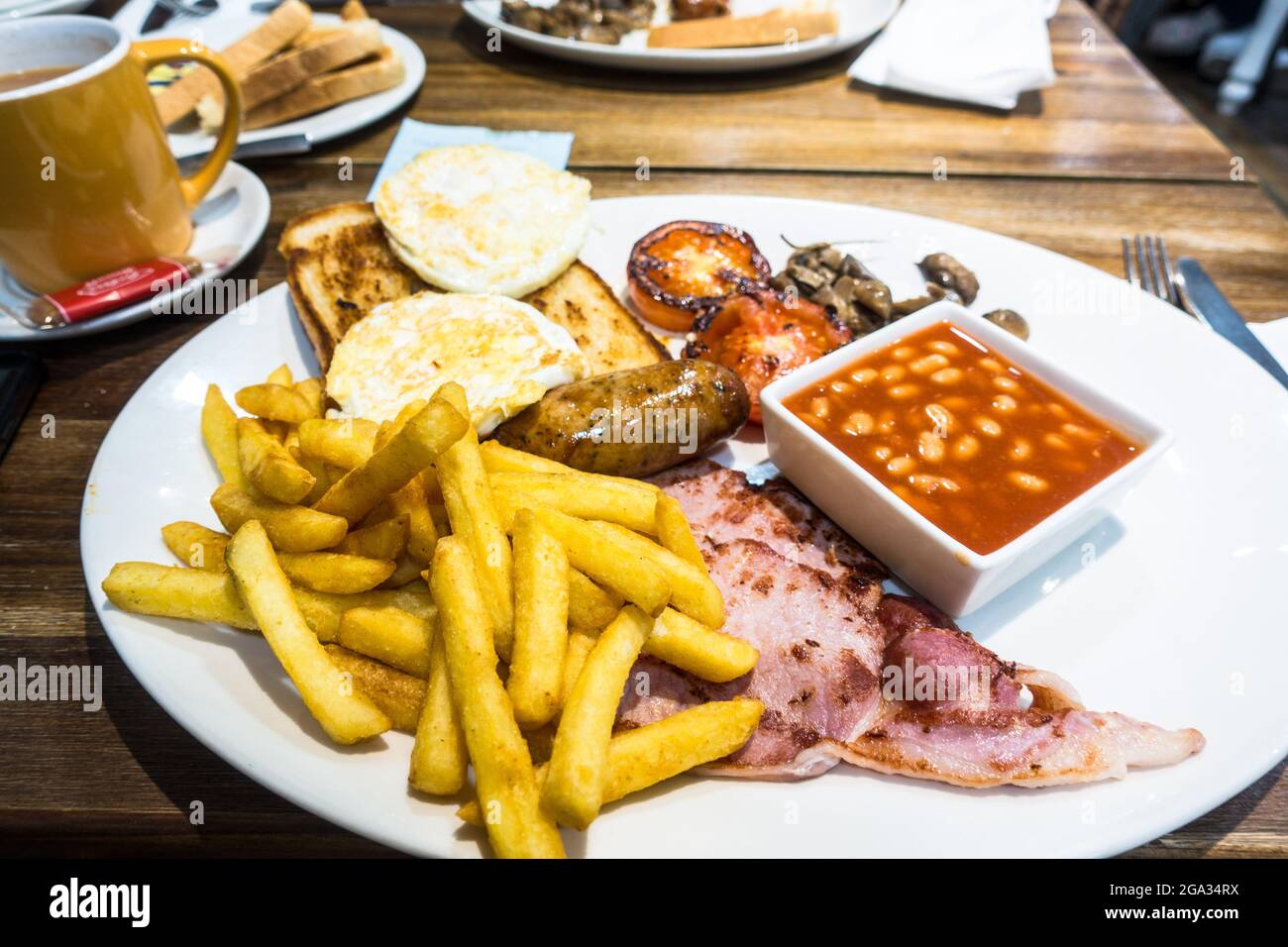 Full English breakfast on a plate in restaurant Stock Photo - Alamy