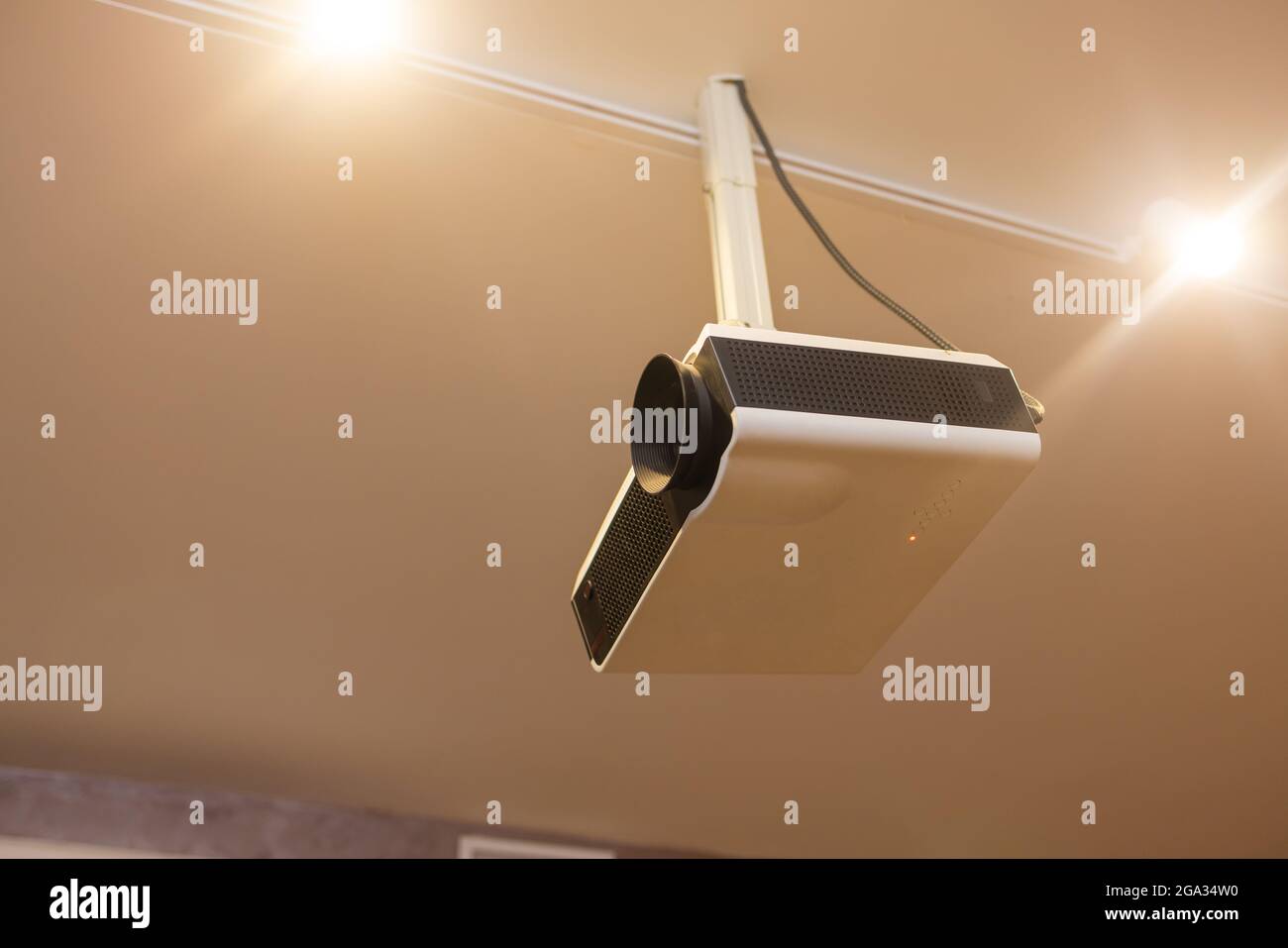A white overhead projector on ceiling indoors Stock Photo - Alamy
