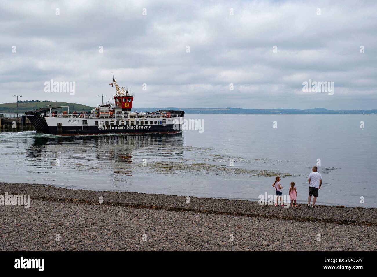 A passenger ferry docking at the port in Largs, Scotland, UK Stock ...