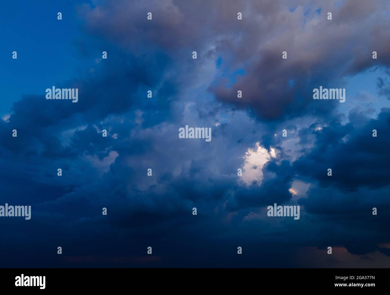 Aerial view from a drone on rain clouds at sunset over the city Stock ...