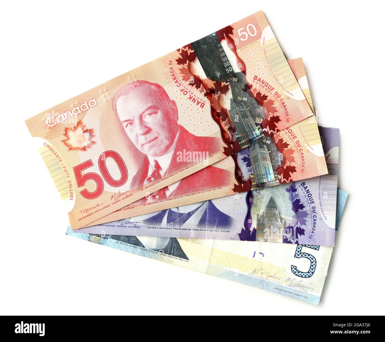 Canadian dollars, isolated on white Stock Photo - Alamy