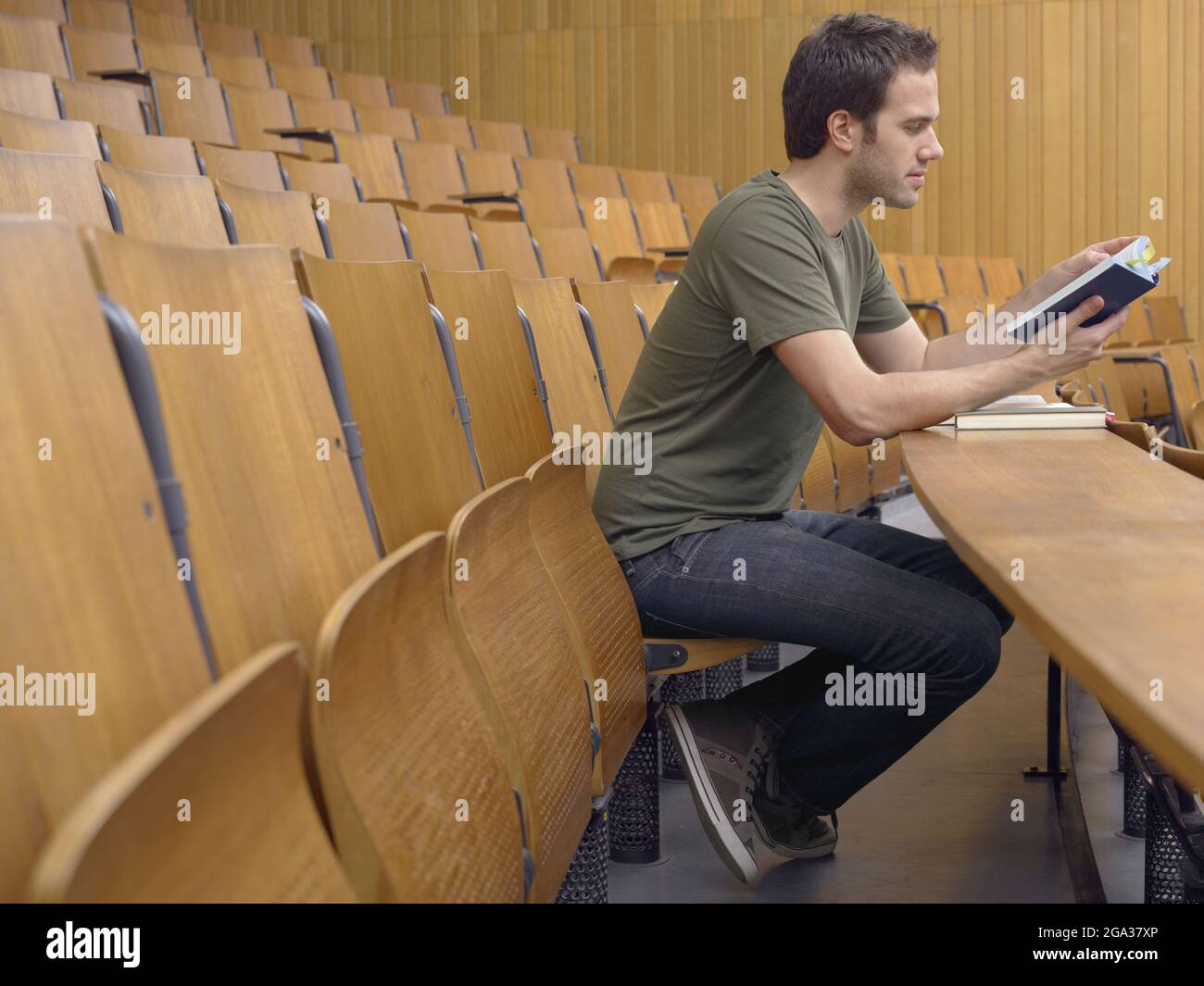 Student reading in an empty lecture hall; Germany Stock Photo - Alamy