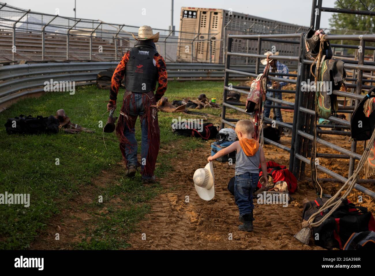 July 3, 2021; Bloomington, Indiana: A boy carries his cowboy hat during ...