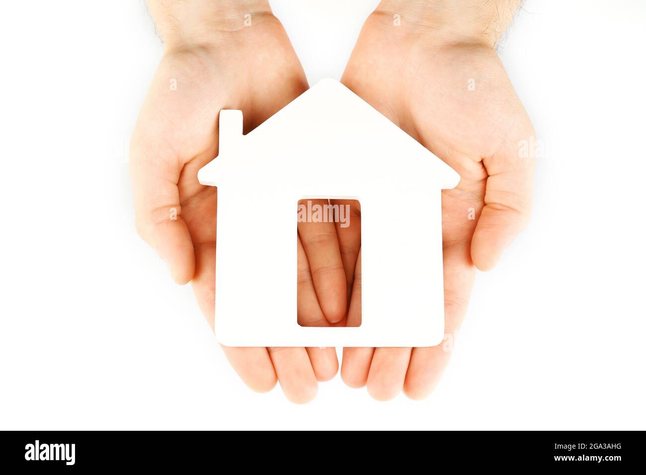 Female hands holding house isolated on white Stock Photo - Alamy