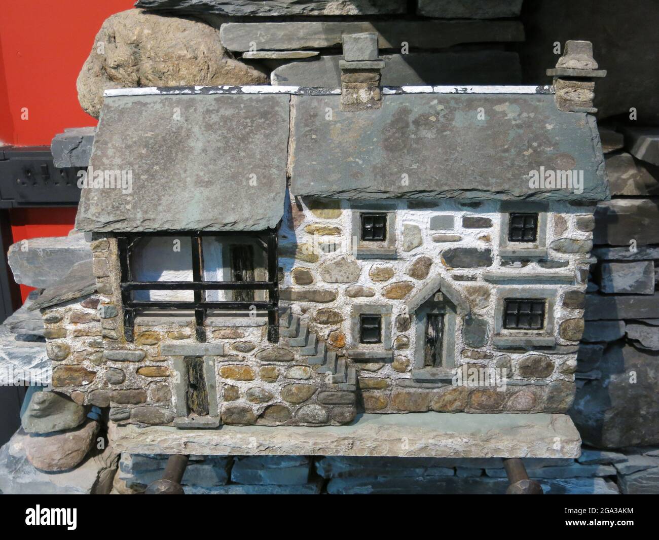 Quaint little model stone cottages of Lakeland stone & slate; part of ...
