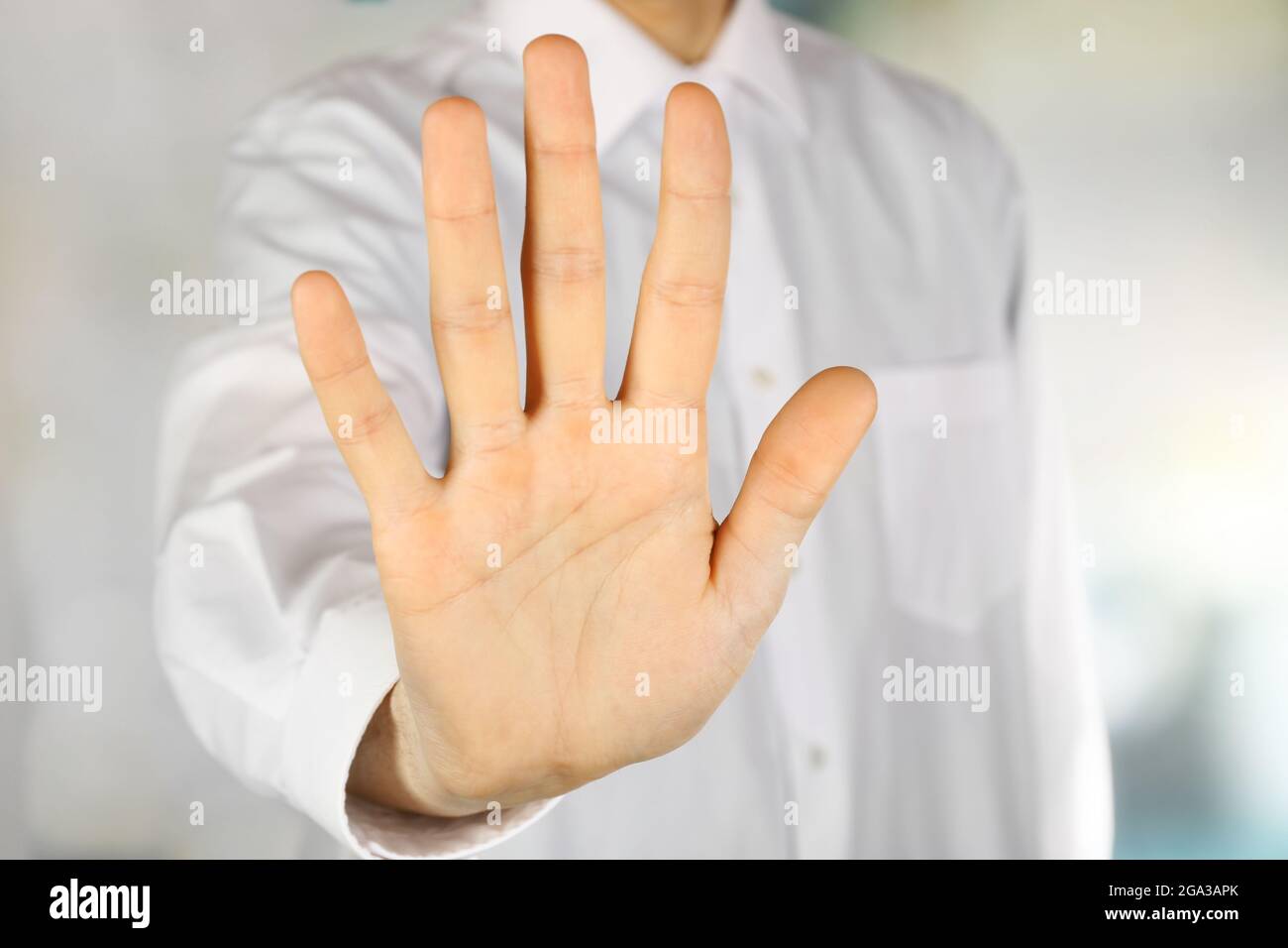Male hand showing stop gesture, closeup Stock Photo - Alamy