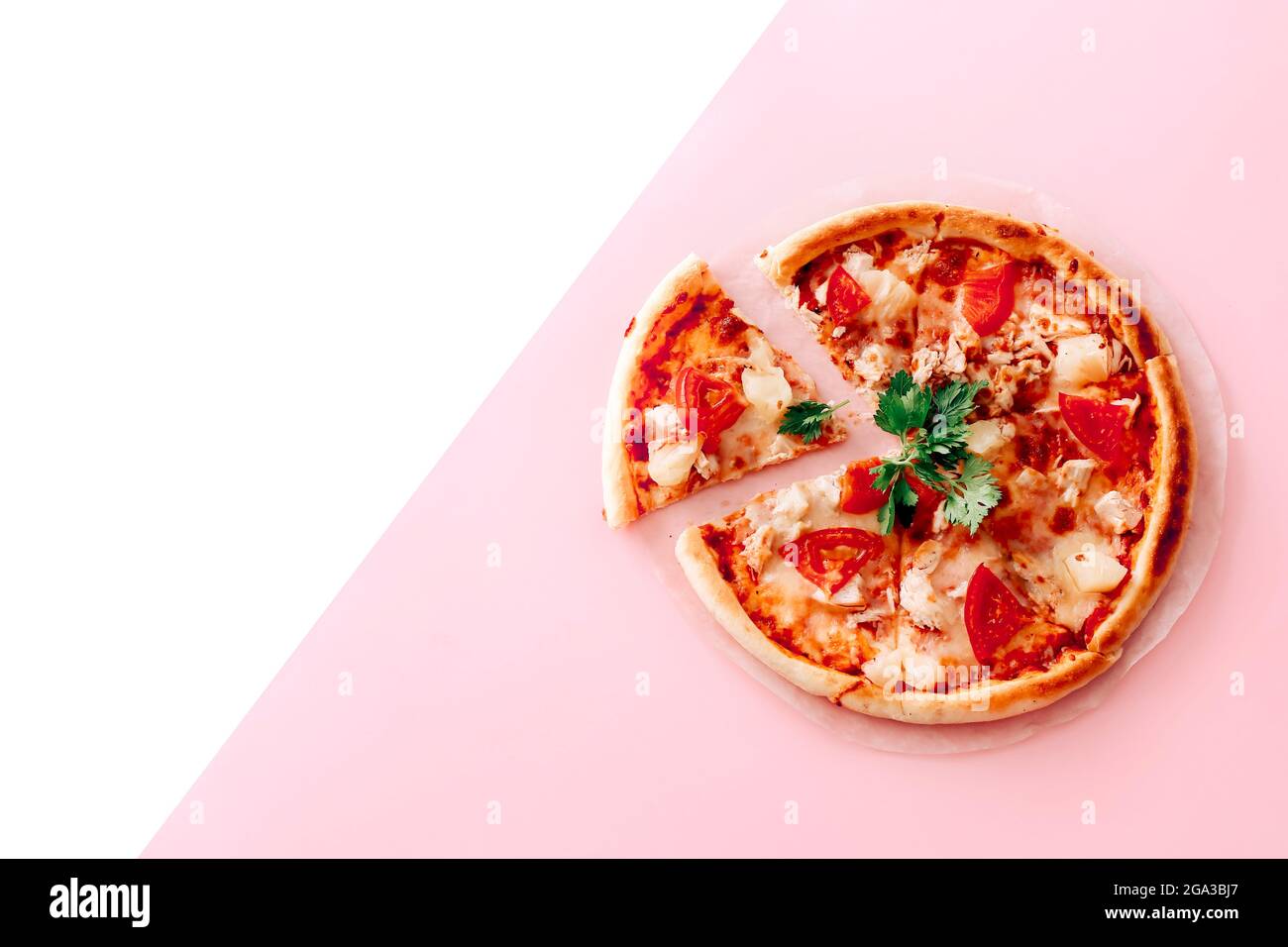 Top view with a sliced pizza on white and pink background Stock Photo ...