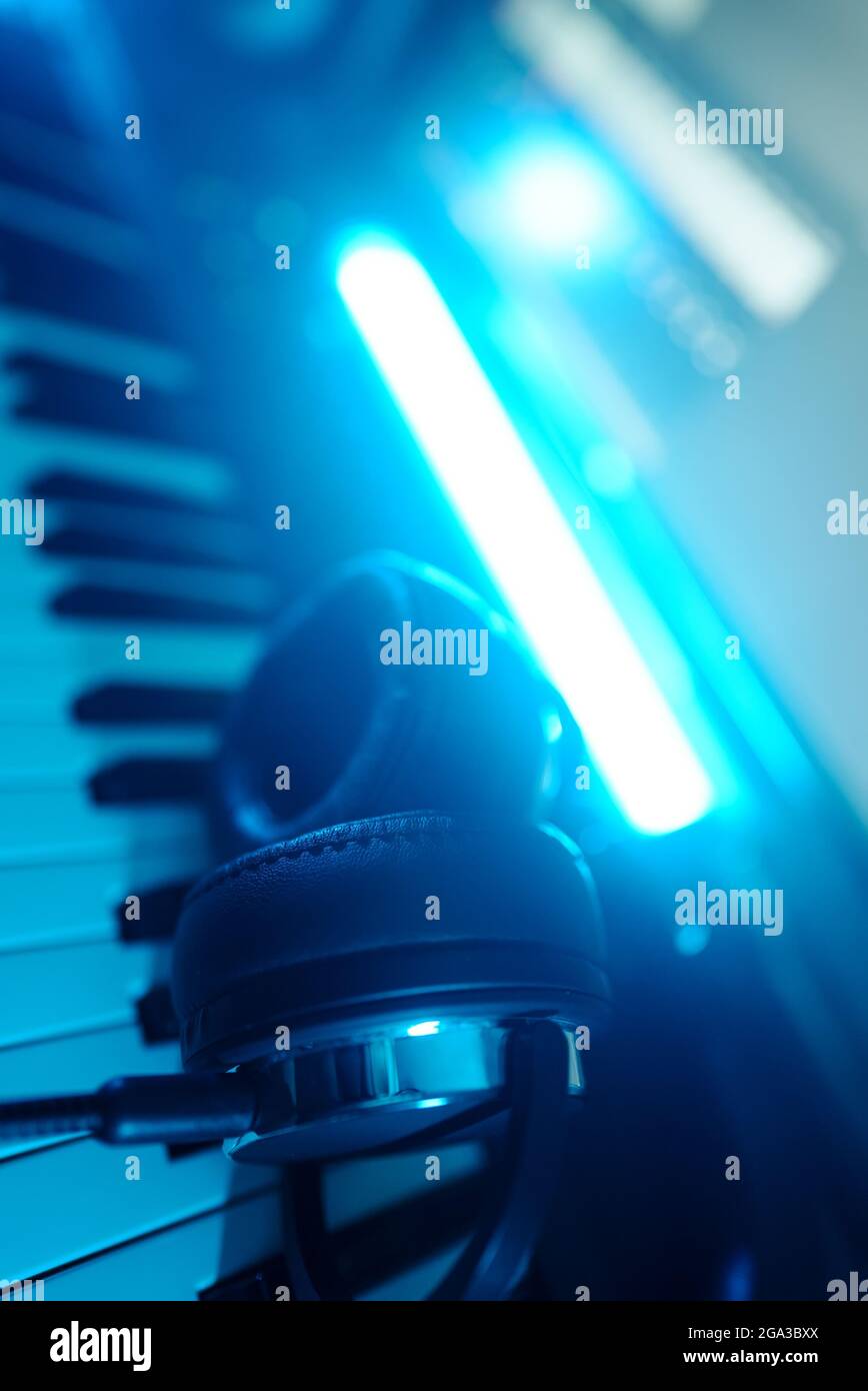 Headphones on the piano keyboard. Recording studio concept Stock Photo ...