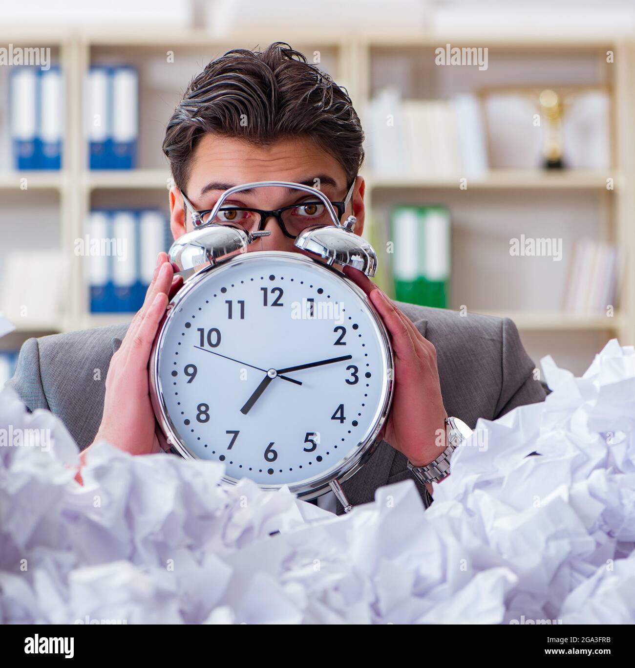 The businessman in paper recycling concept in office Stock Photo - Alamy