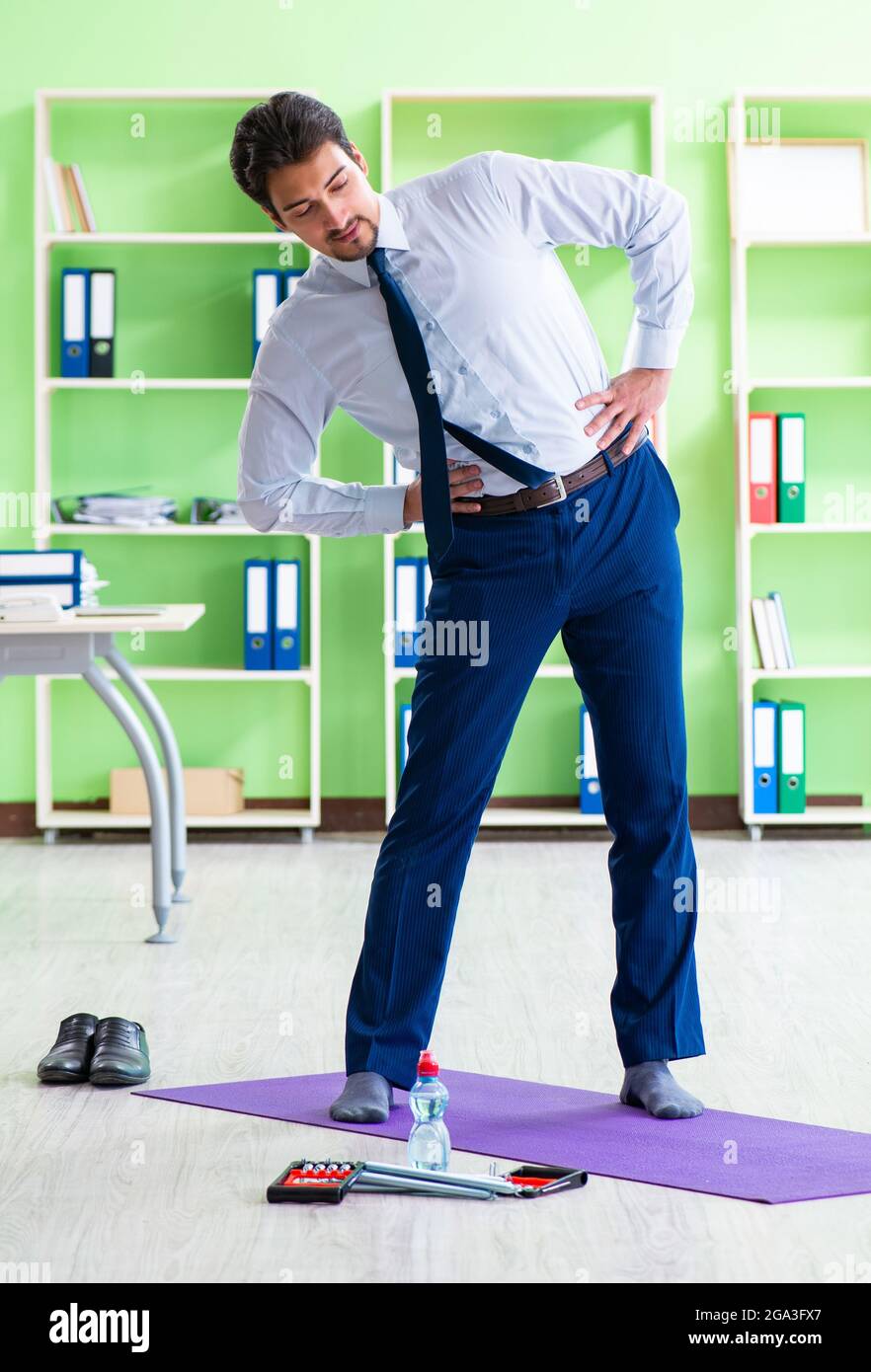 The employee doing exercises during break at work Stock Photo - Alamy