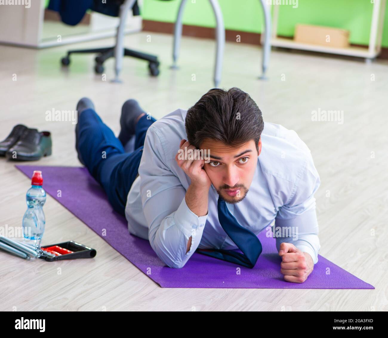 The employee doing exercises during break at work Stock Photo - Alamy