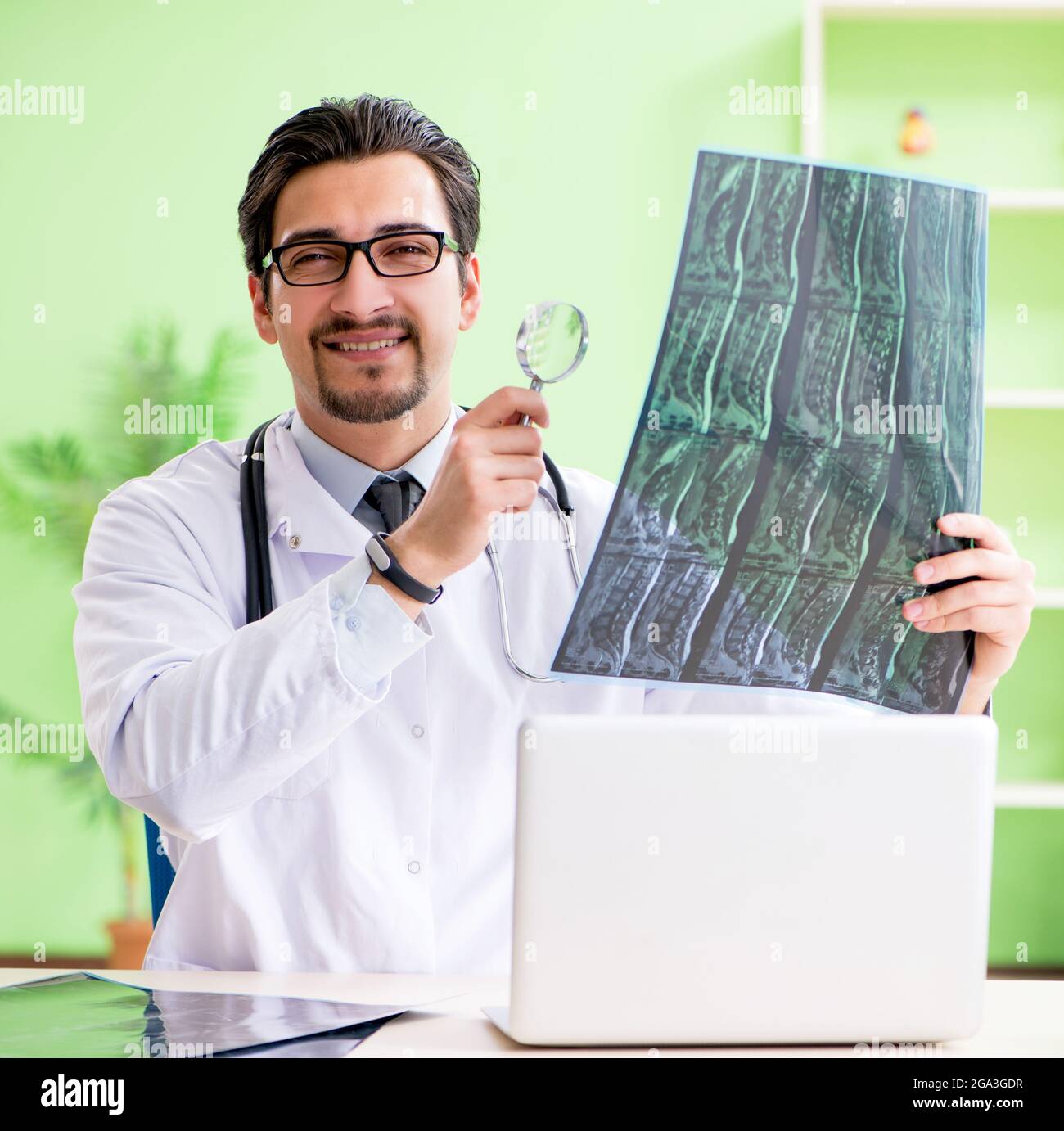The doctor radiologist looking at x-ray scan in hospital Stock Photo ...