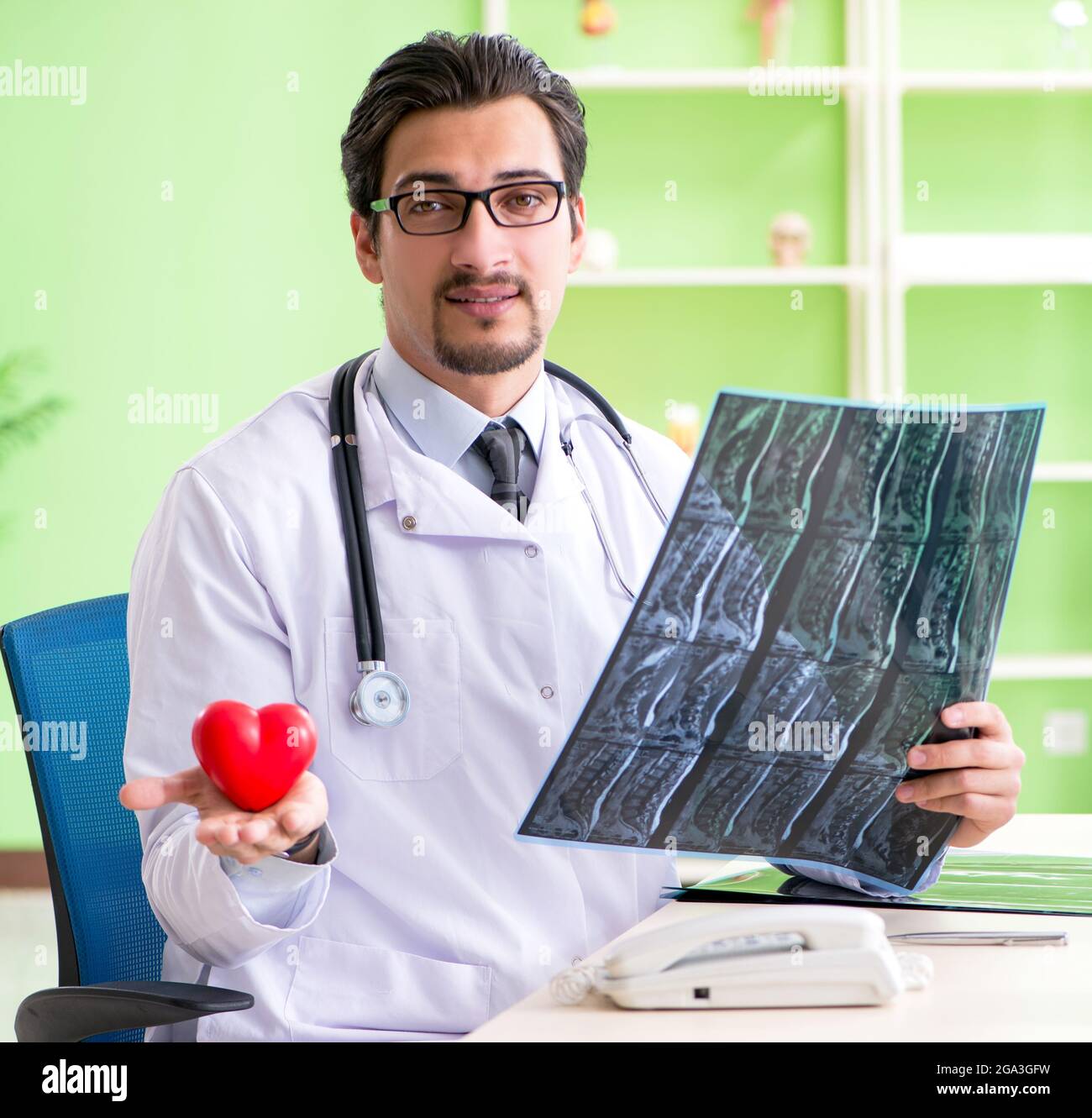 The doctor radiologist looking at x-ray scan in hospital Stock Photo ...