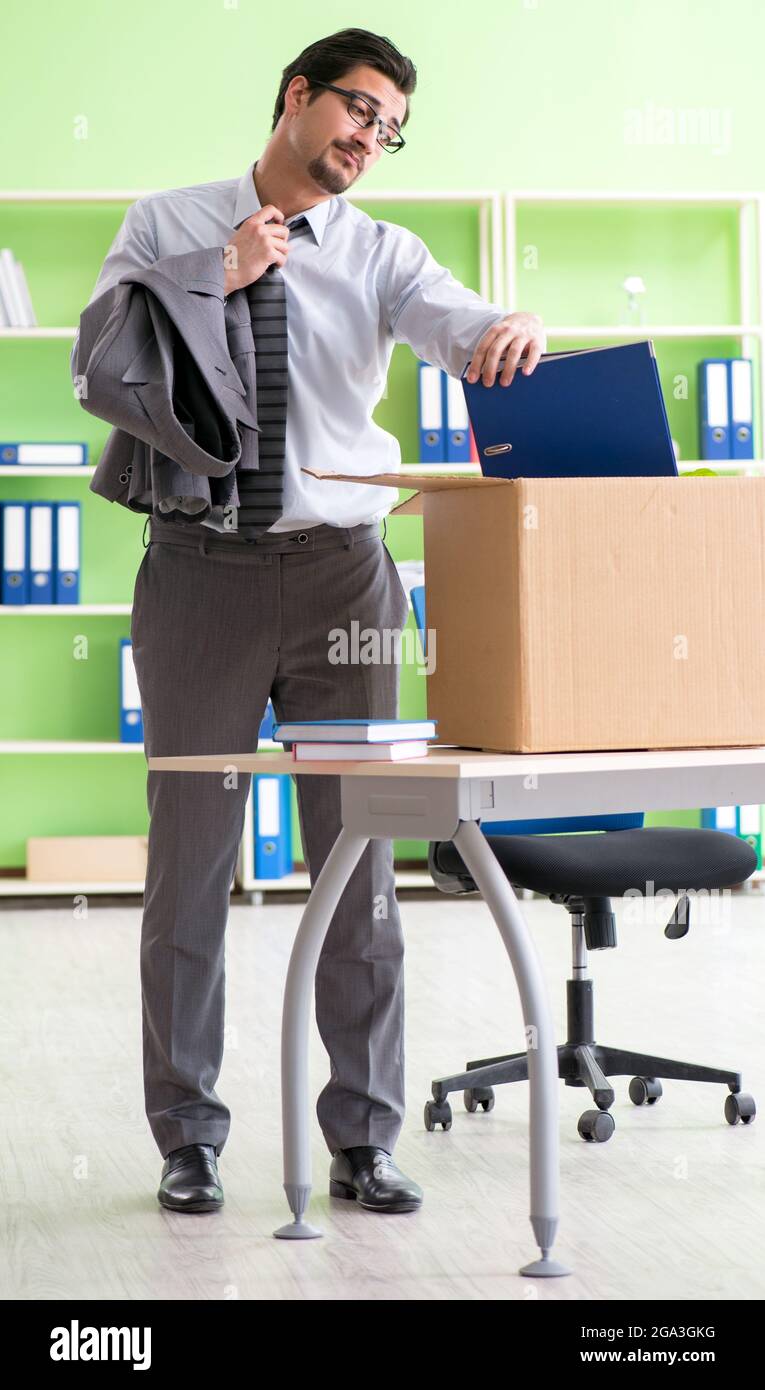 The male employee collecting his stuff after redundancy Stock Photo - Alamy