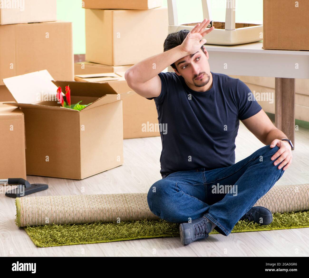 The man moving house with boxes Stock Photo - Alamy