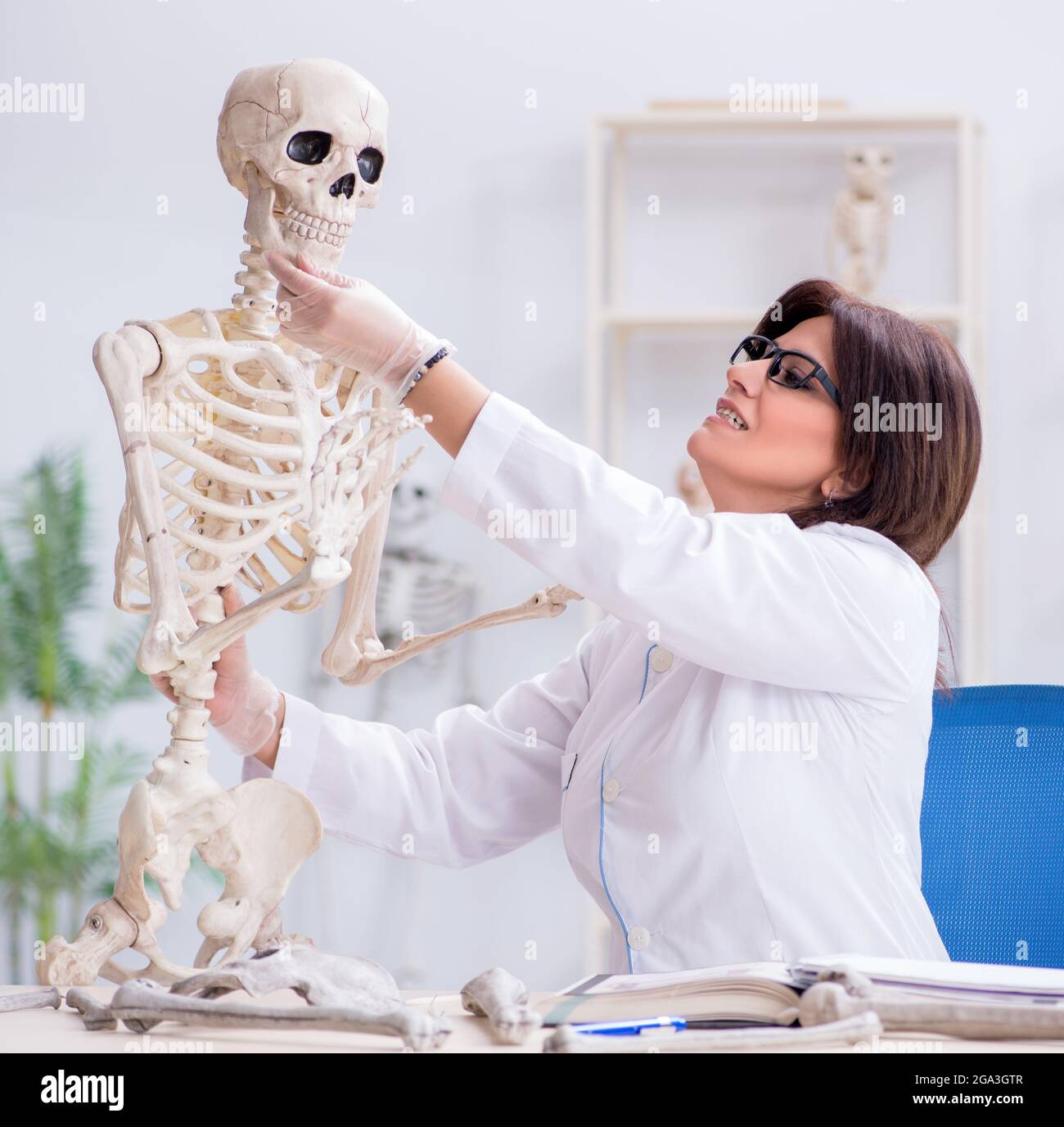 The doctor working in the lab on skeleton Stock Photo - Alamy