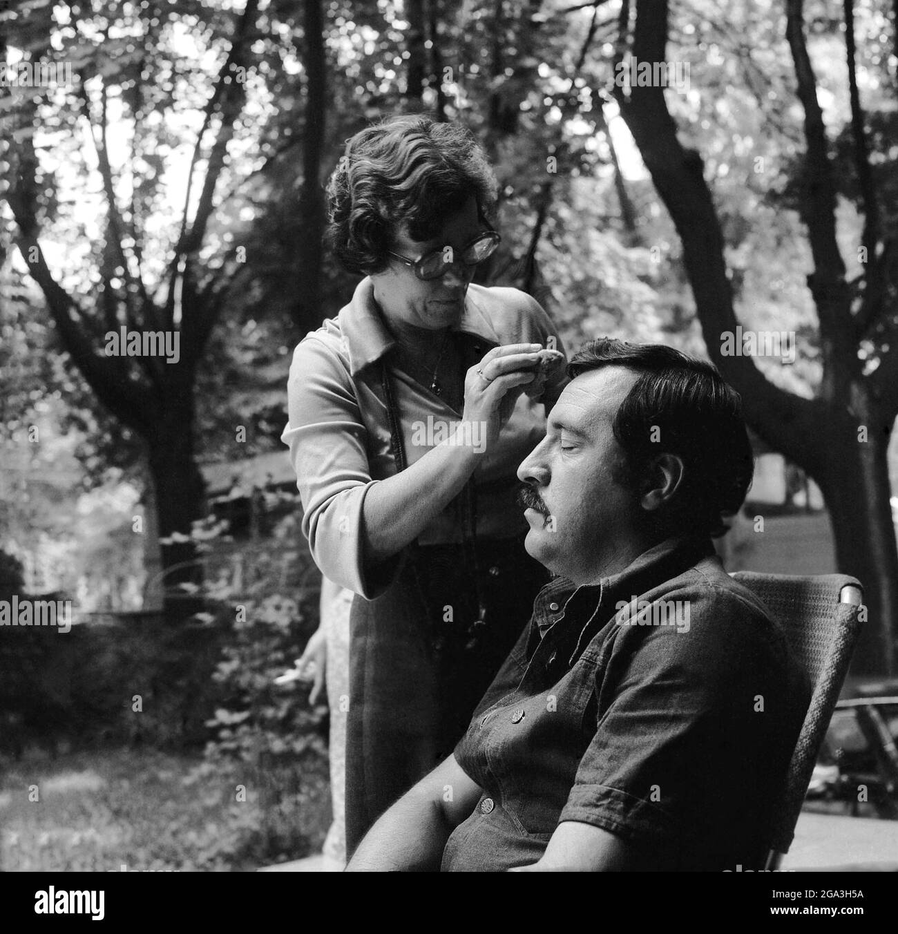 Romanian actor Costel Constantin having makeup applied for the shooting ...