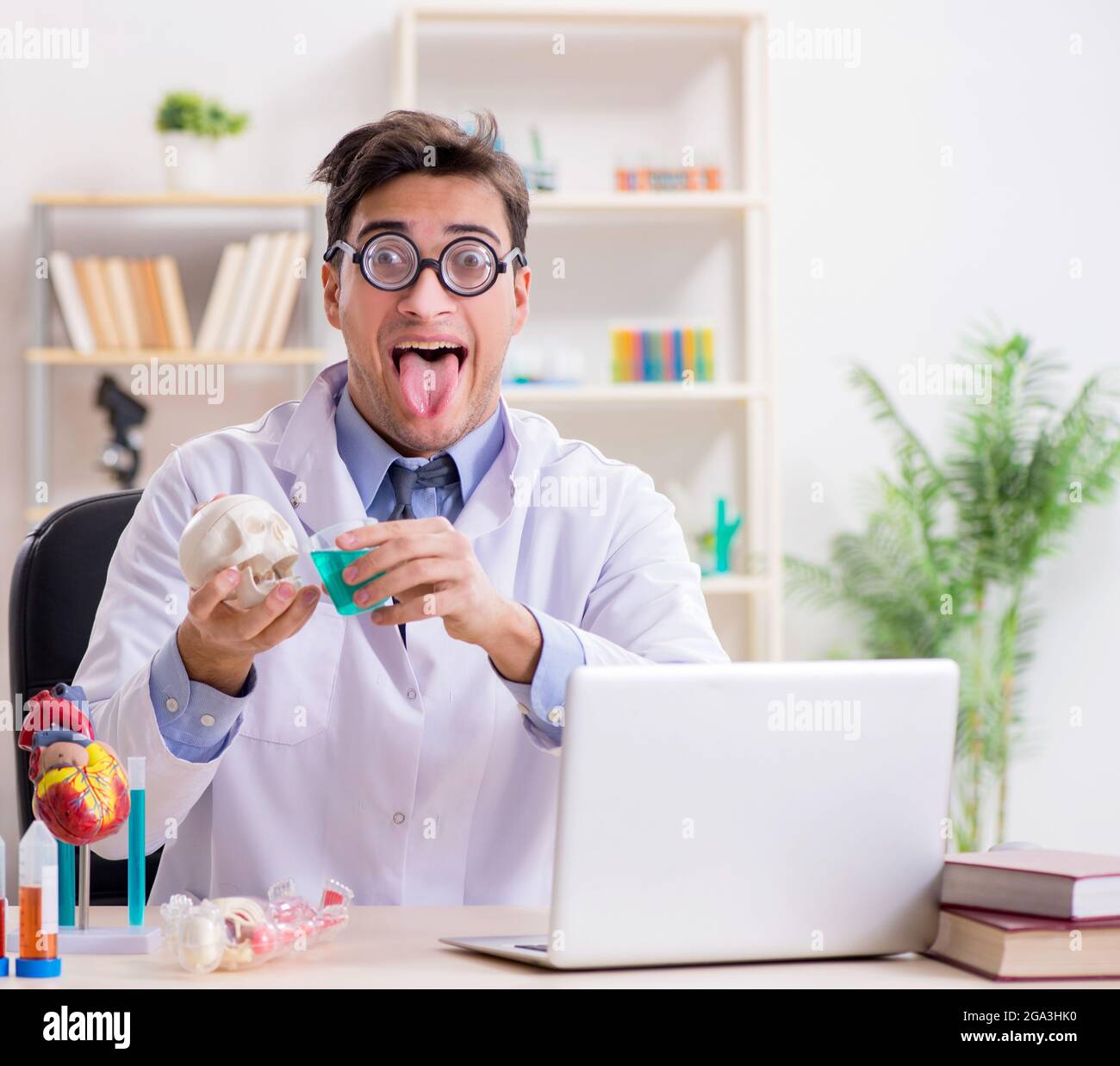 The funny doctor having fun in hospital lab Stock Photo - Alamy