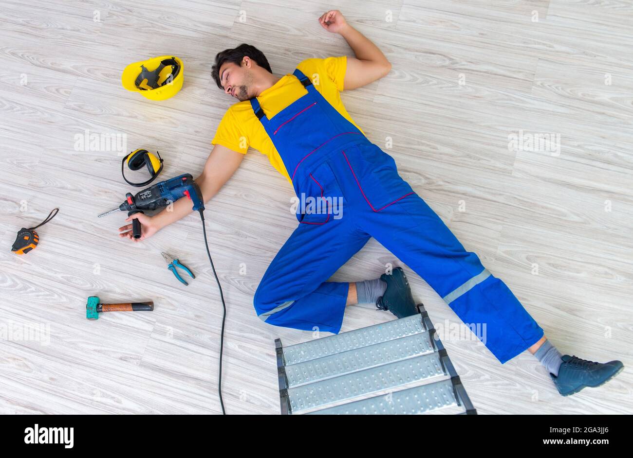 The injured worker at the work site Stock Photo - Alamy