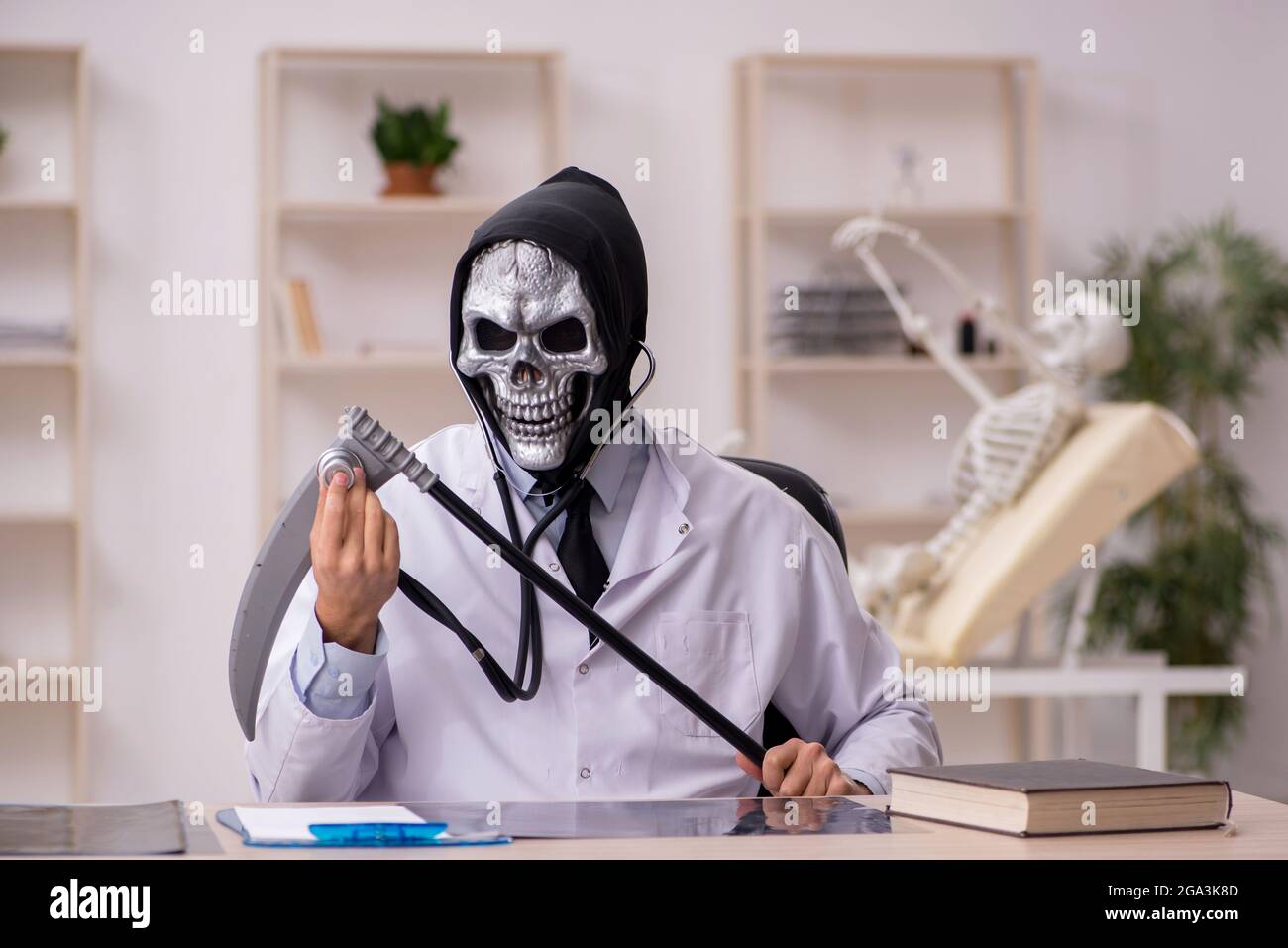 Reaper grim doctor examining skeleton patient in the clinic Stock Photo ...