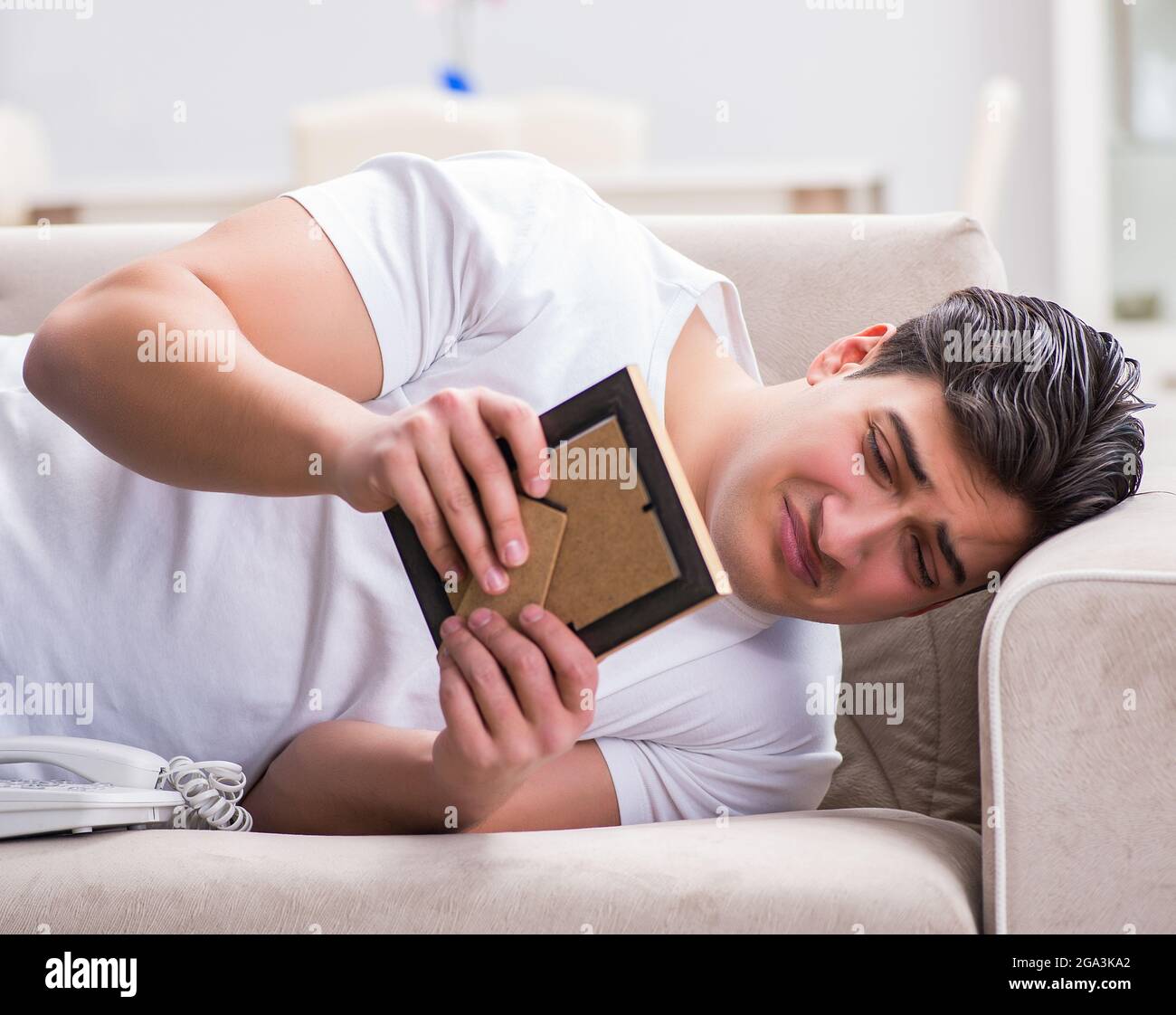 The young man in sad saint valentine concept Stock Photo - Alamy