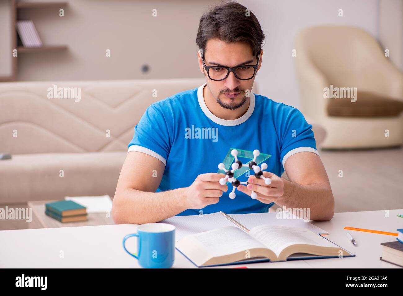 Young student physicist studying molecular model Stock Photo - Alamy