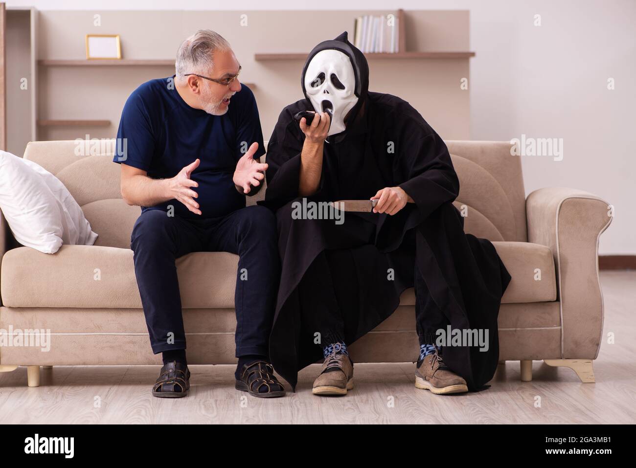 Devil coming to old dying man Stock Photo - Alamy