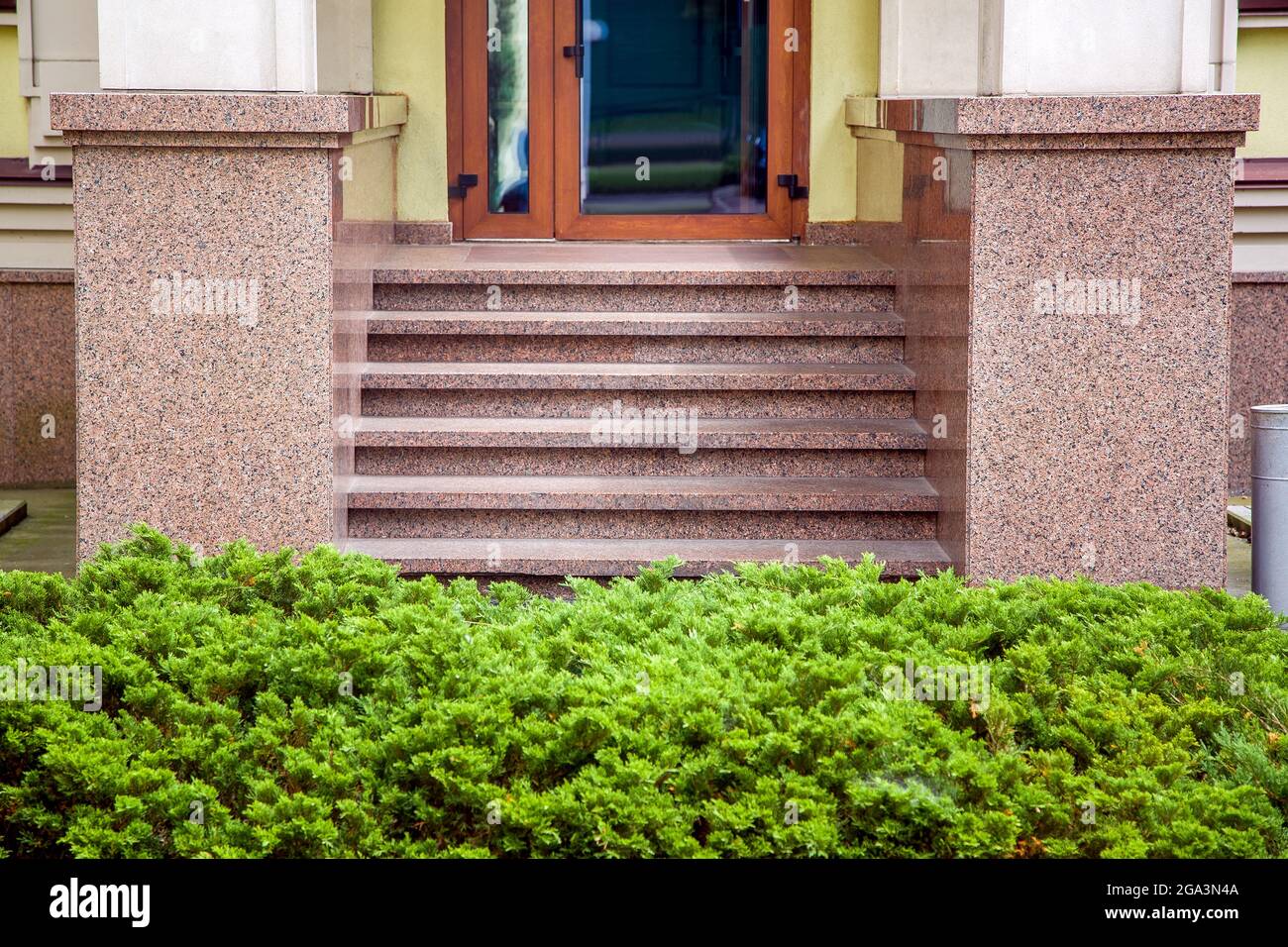 a wooden door with a frame and glass inserts on the facade of a ...