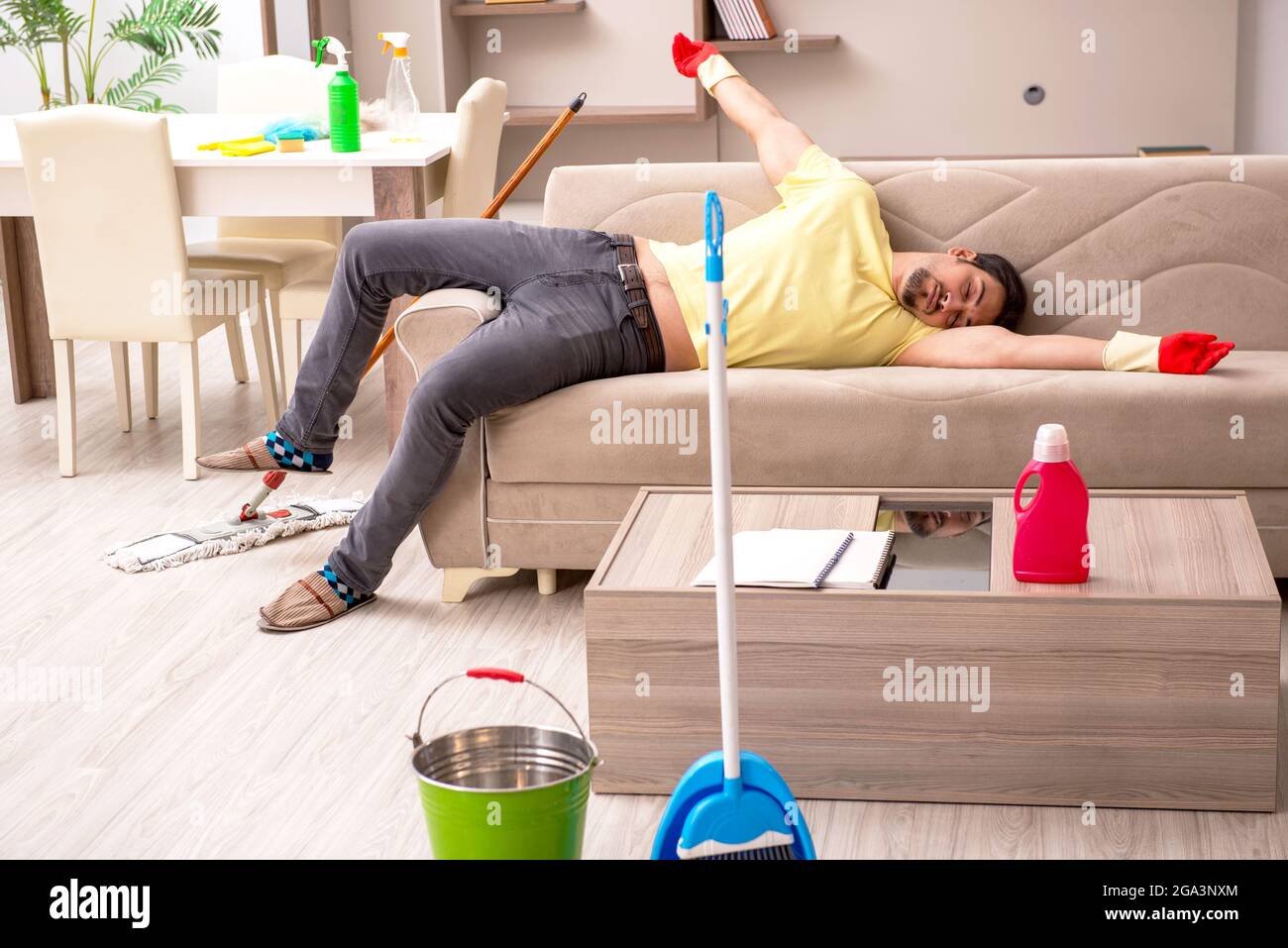 Young male cleaner cleaning the house Stock Photo - Alamy