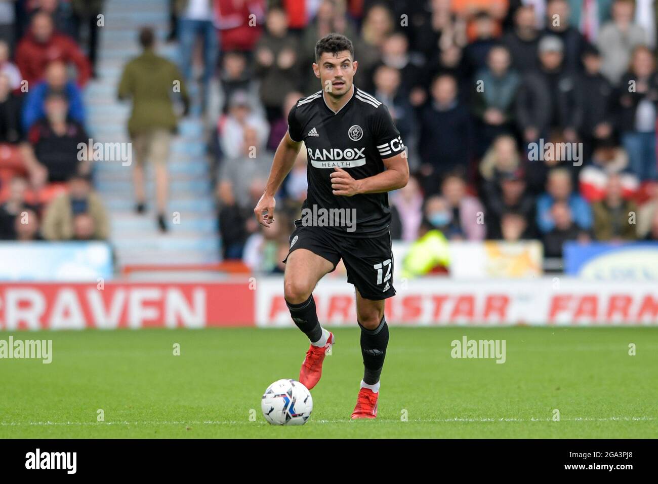 Doncaster, UK. 28th July, 2021. John Egan #12 of Sheffield United runs ...