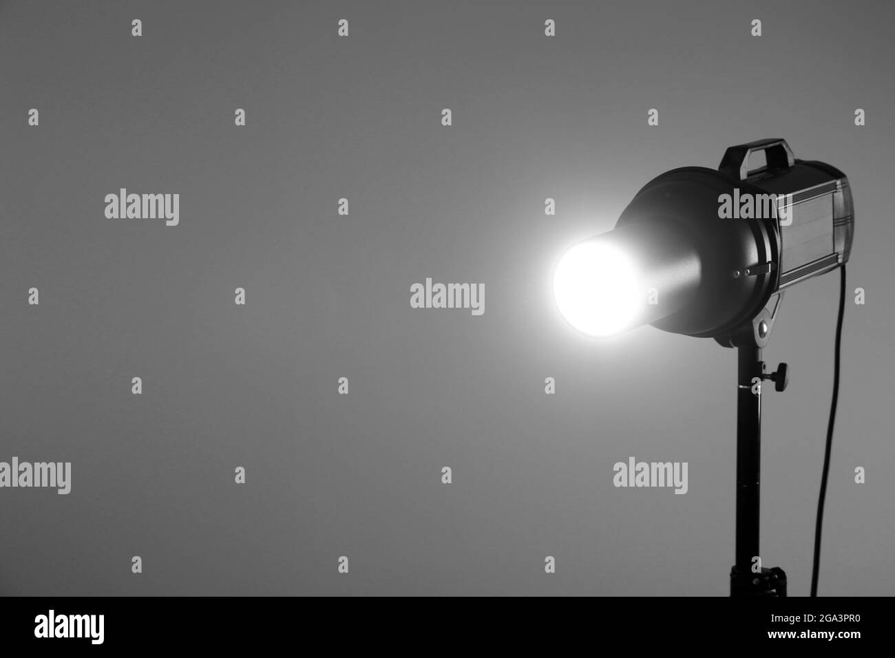 Photo studio with lighting equipment on grey wall background Stock ...