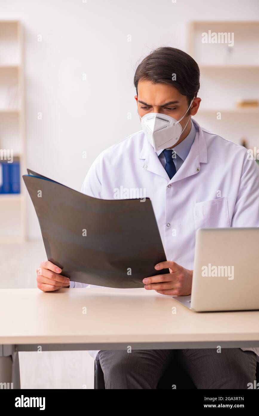 Young doctor radiologist working in the clinic during pandemic Stock ...