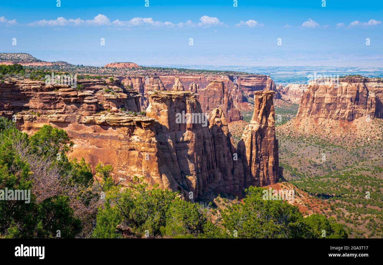 Sandstone cliffs and pinnacles line the canyon of the Colorado National ...