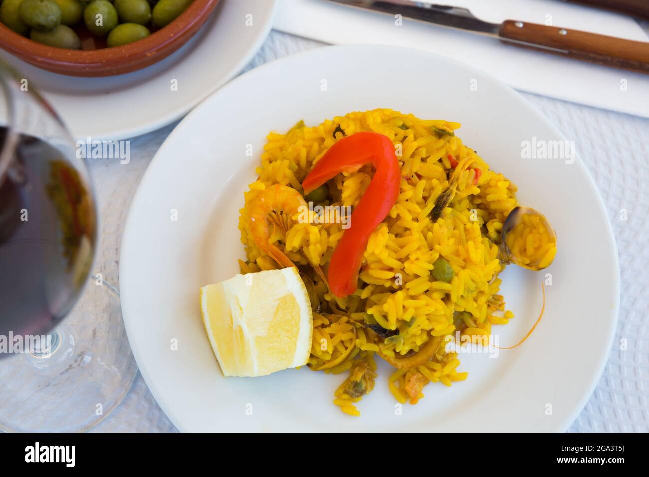 Delicious seafood paella - traditional Valencian rice dish with shrimps ...