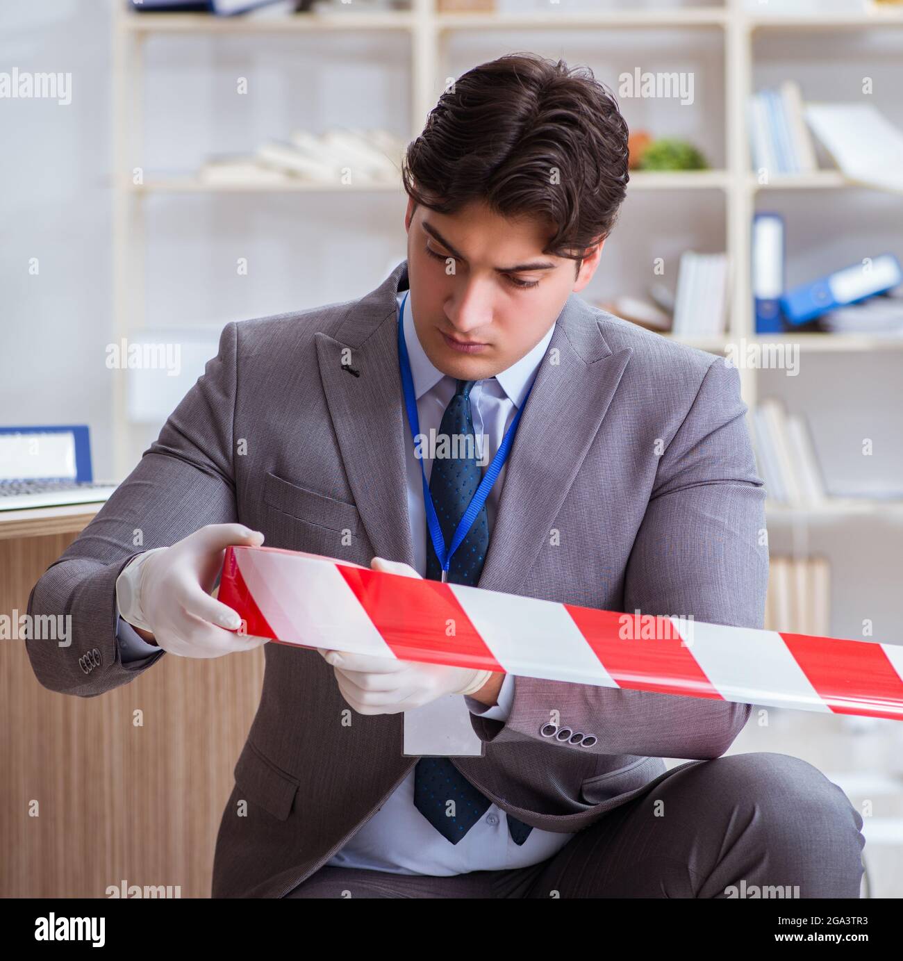 The young man during crime investigation in office Stock Photo - Alamy