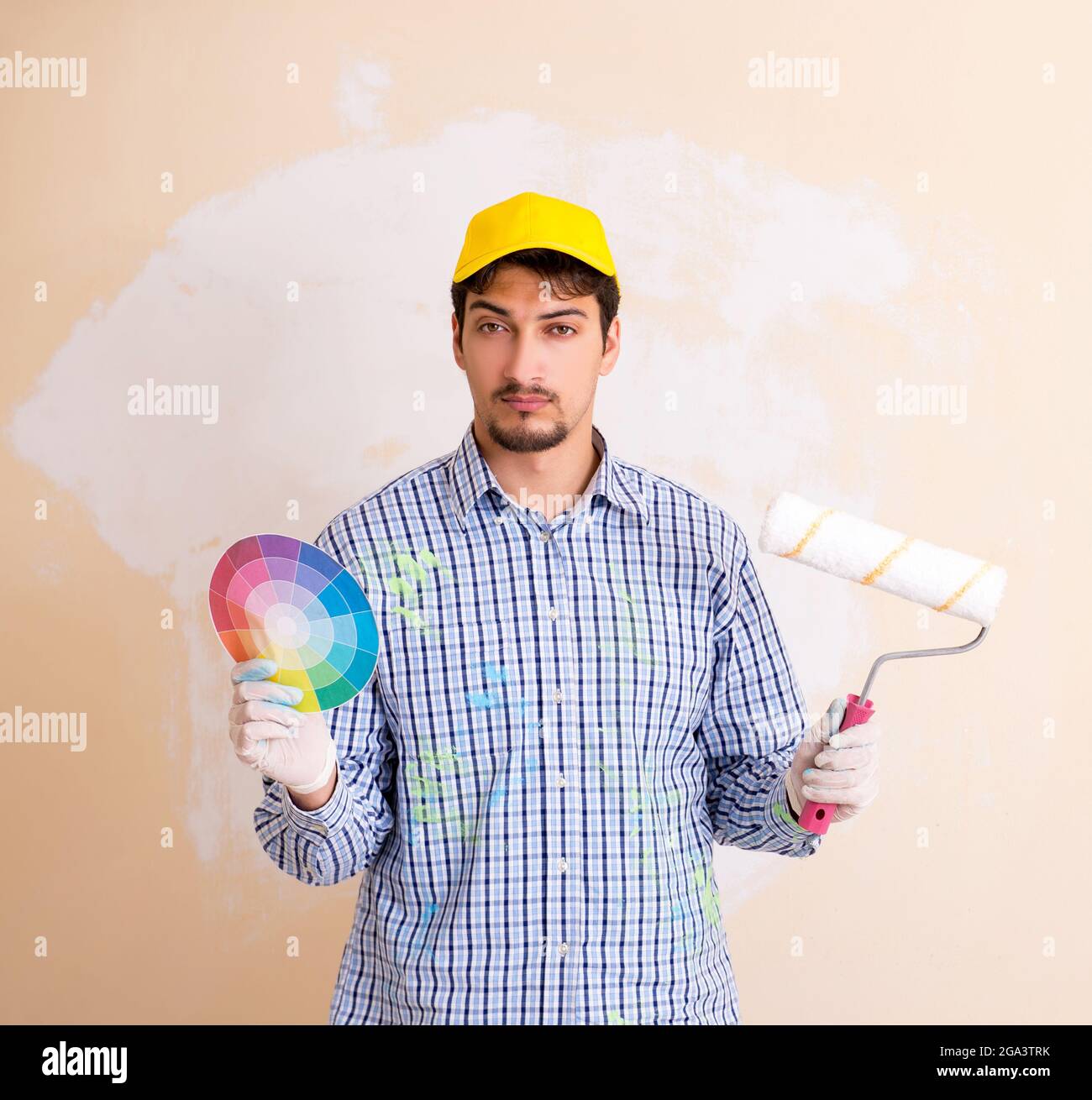 The painter man painting the wall at home Stock Photo - Alamy