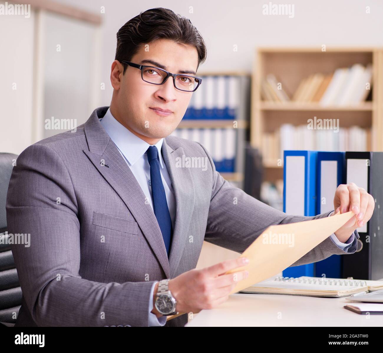 The businessman receiving letter in the office Stock Photo - Alamy