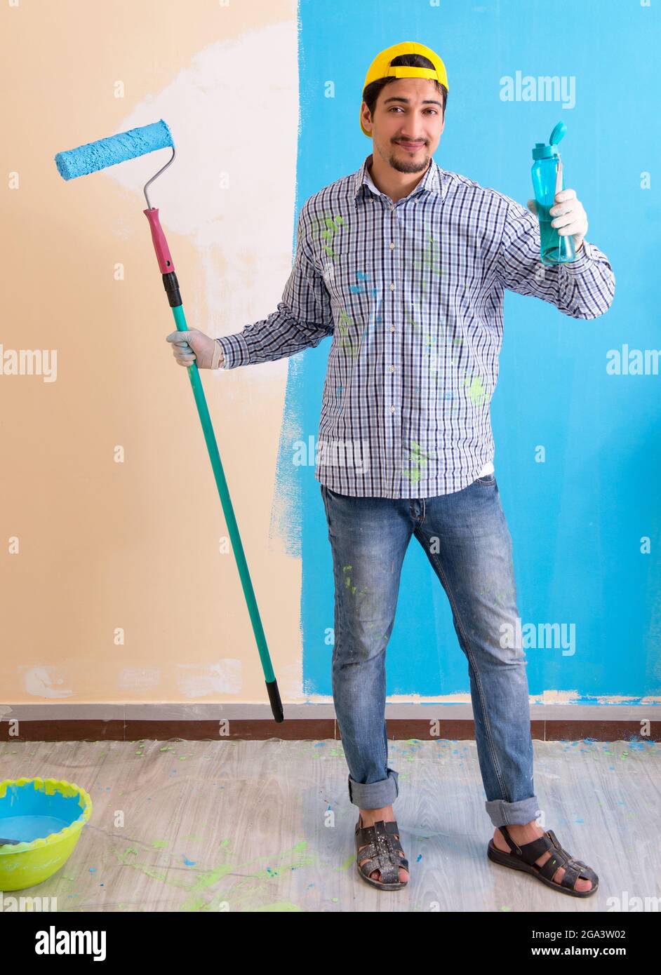 The painter man painting the wall at home Stock Photo - Alamy
