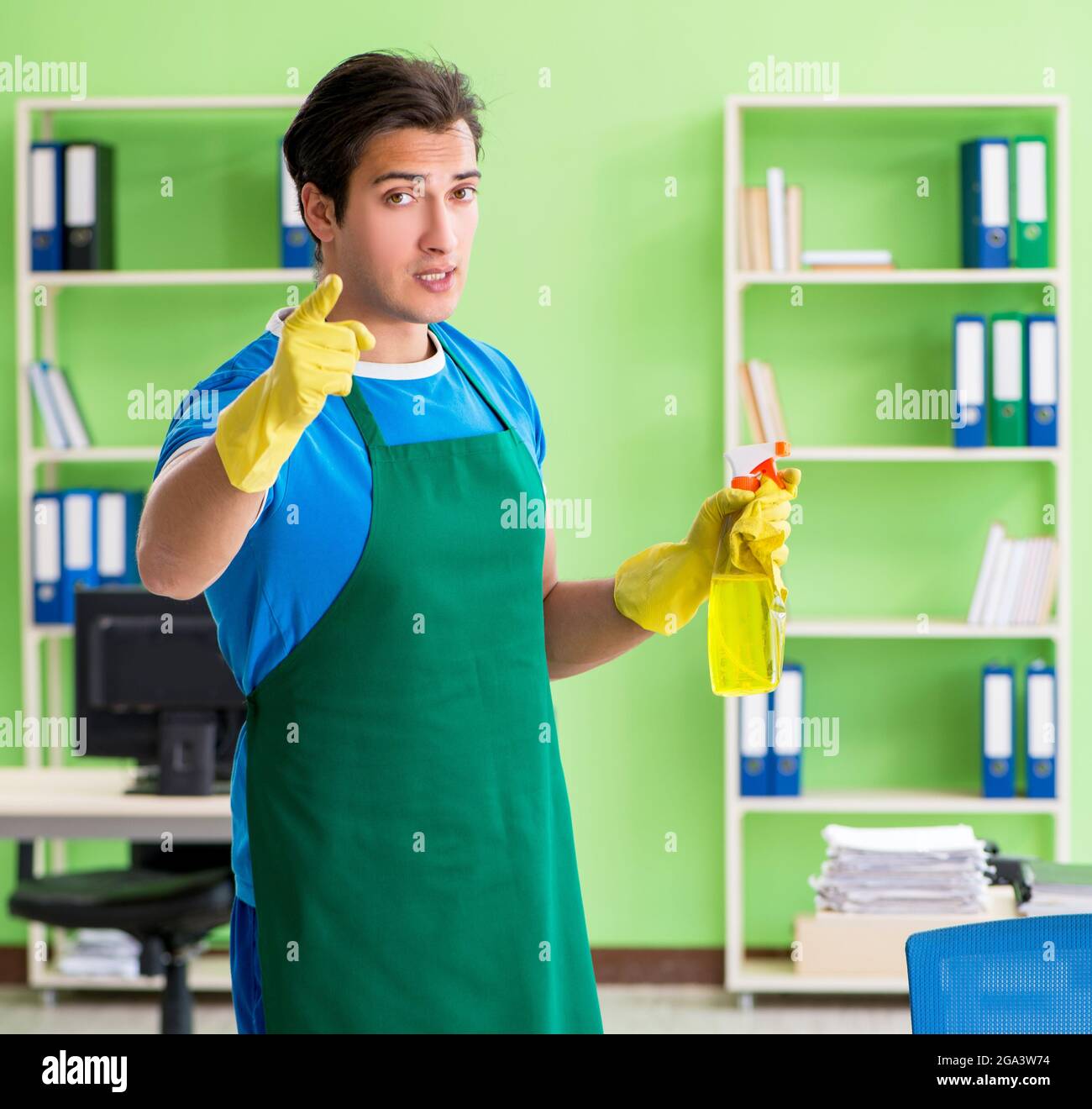 The male handsome professional cleaner working in the office Stock ...