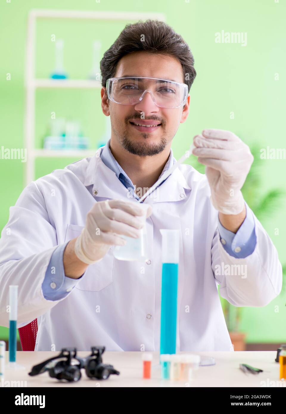 The man chemist working in the lab Stock Photo - Alamy