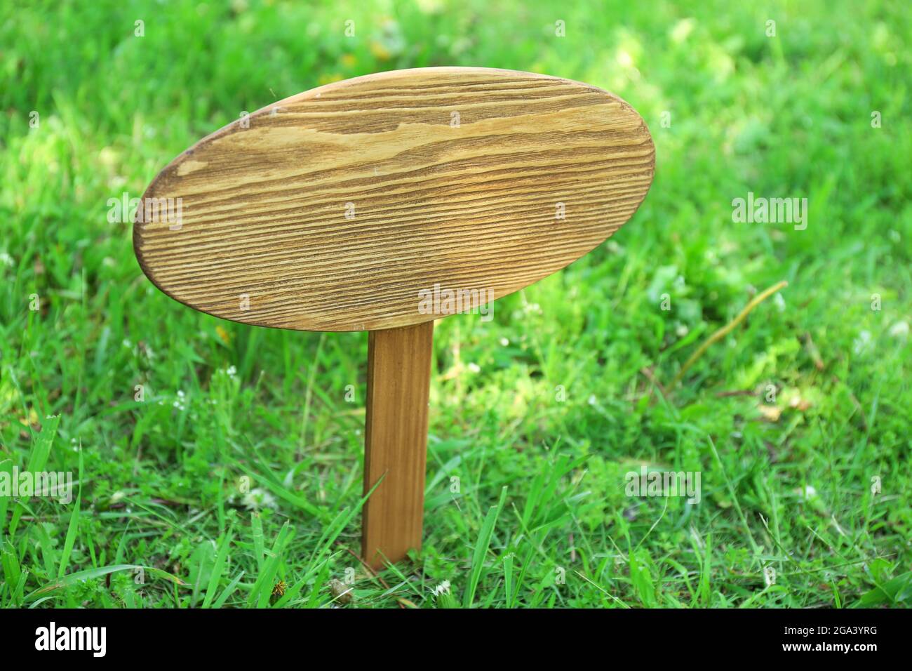 Wooden signboard over grass, outdoors Stock Photo - Alamy
