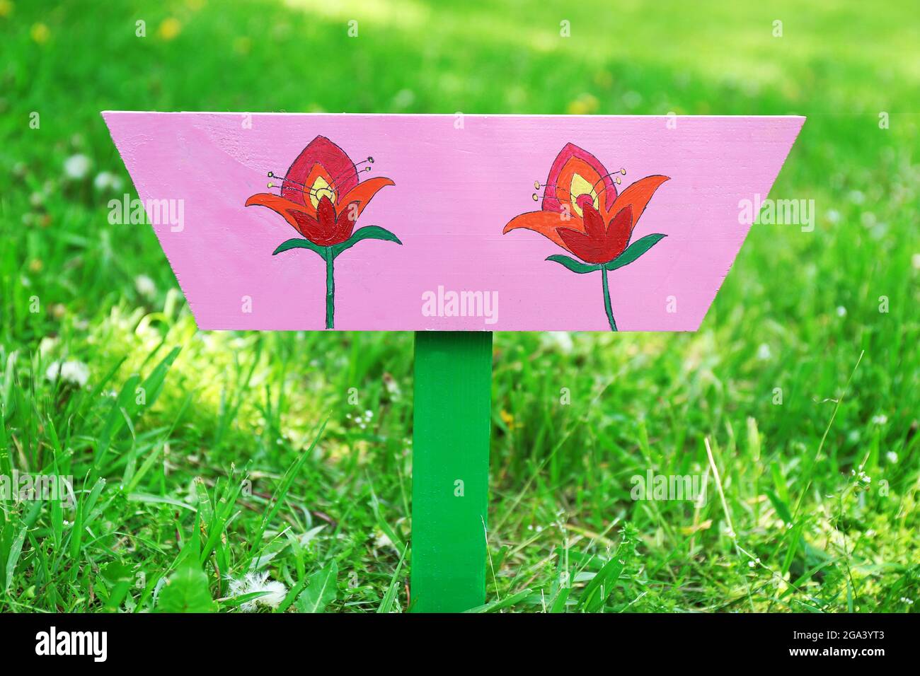 Wooden signboard over grass, outdoors Stock Photo - Alamy